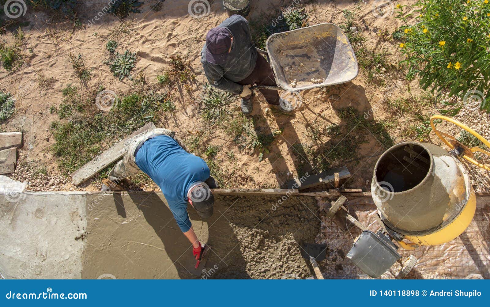 Workers Pour Concrete Solution at a Construction Site Editorial Stock ...