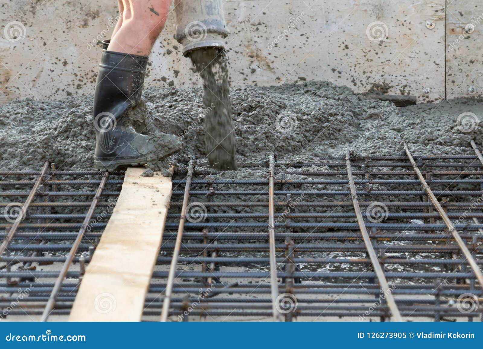 Workers Pour the Foundation for the Construction of a Residential ...