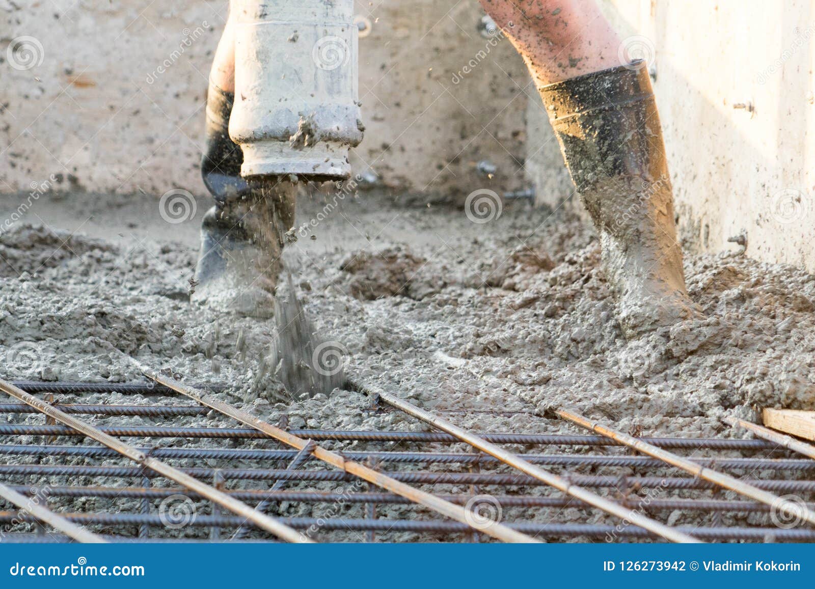 Workers Pour the Foundation for the Construction of a Residential ...