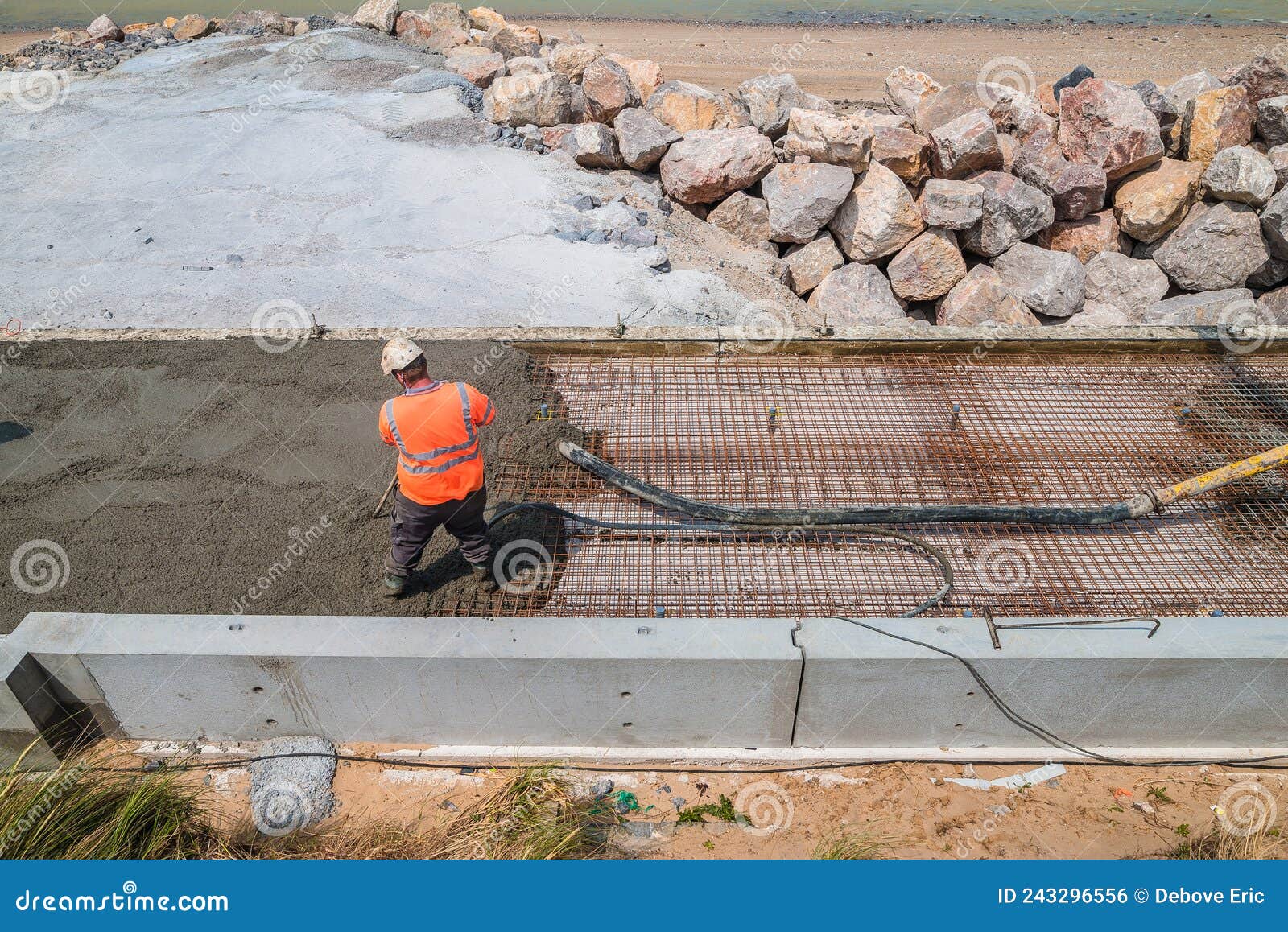 Workers Pouring a Concrete Slab on a Construction Site Stock Photo ...