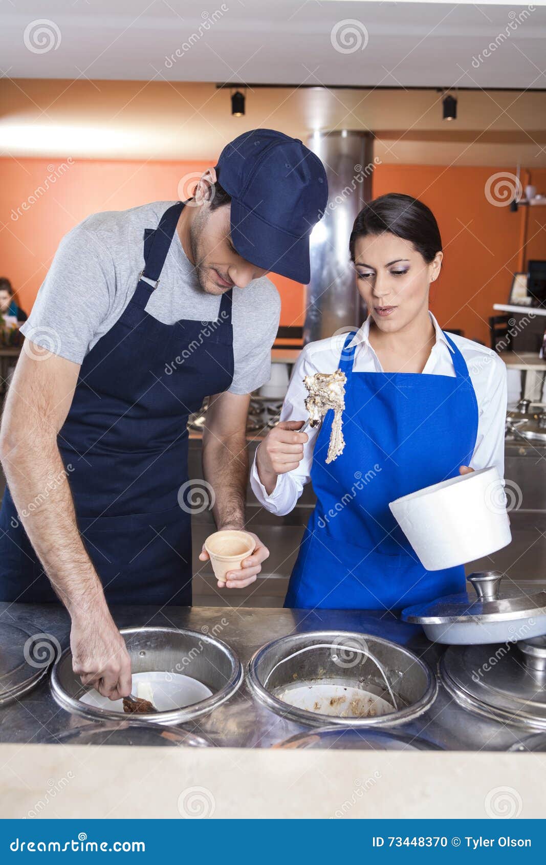 Workers Preparing Ice Creams at Counter in Parlor Stock Photo - Image ...