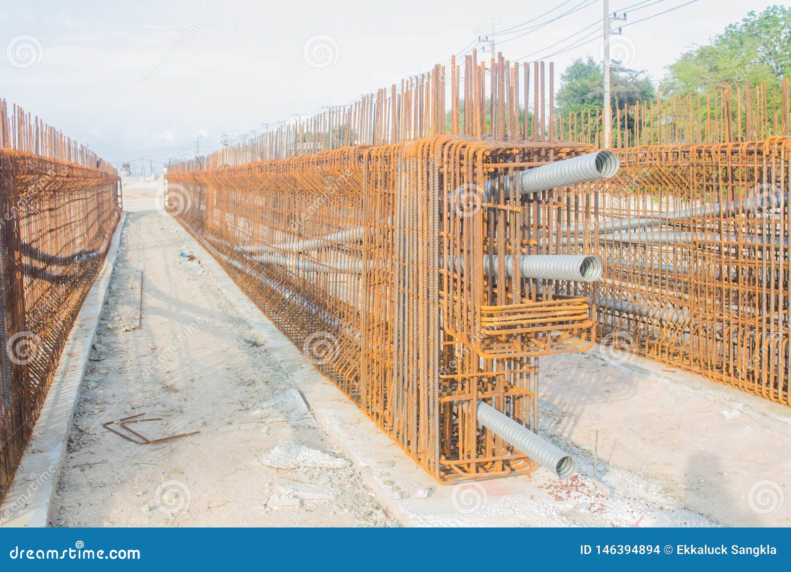 The Workers are Preparing a Steel Construction To Build a New Bridge ...