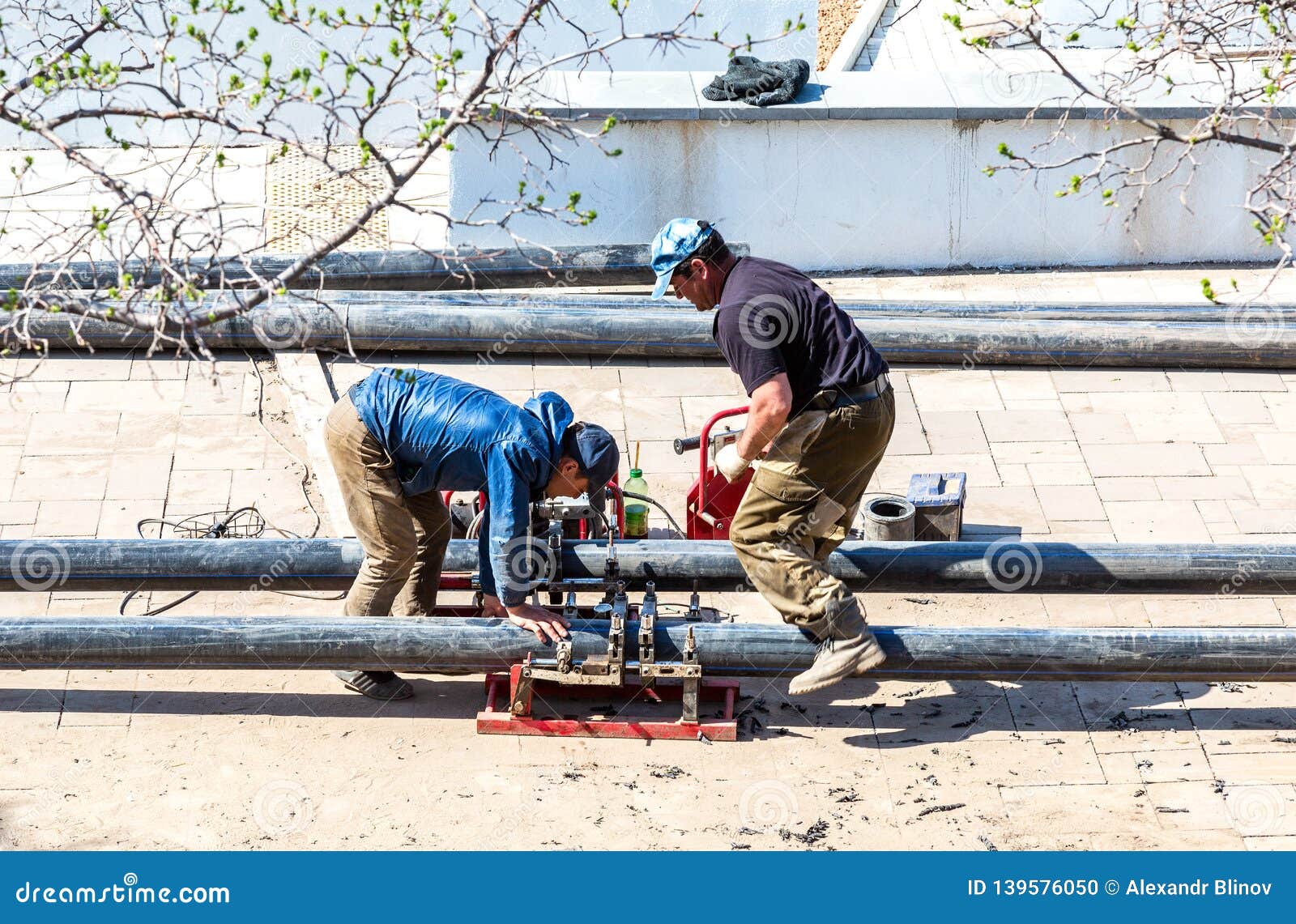 Workers Produce Work of Laying Plastic Pipes Editorial Image - Image of ...