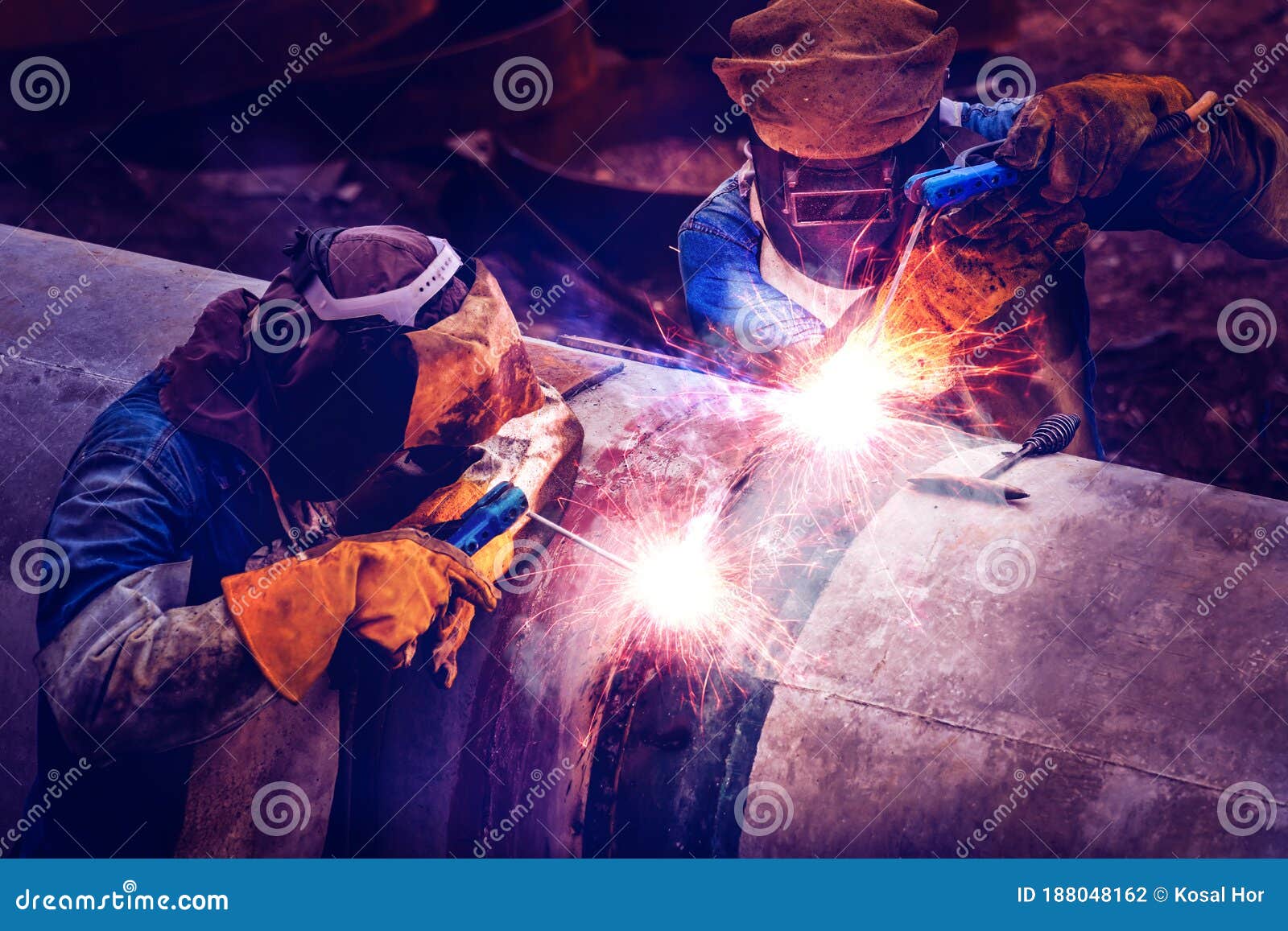 Workers with Protective Masks Welding Bore Pile Metal Casing at a ...