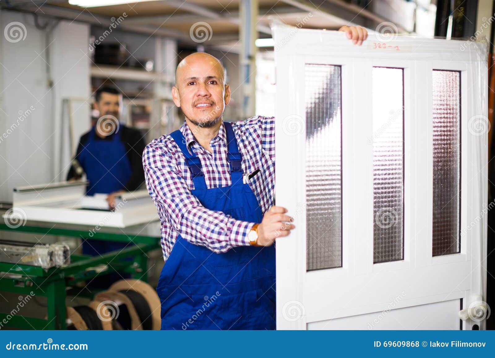 Workers with PVC doors stock photo. Image of males, house - 69609868