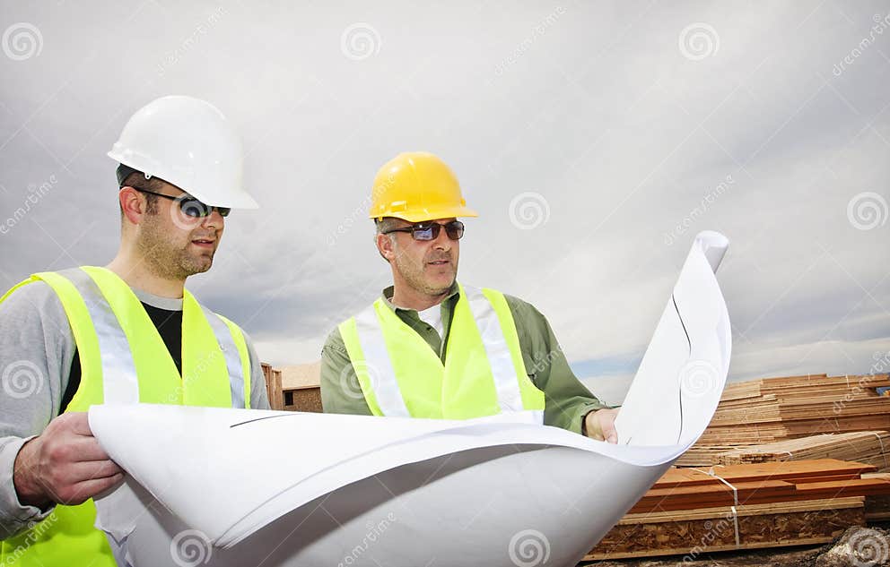 Workers Reading Construction Plans Stock Photo - Image of builder ...
