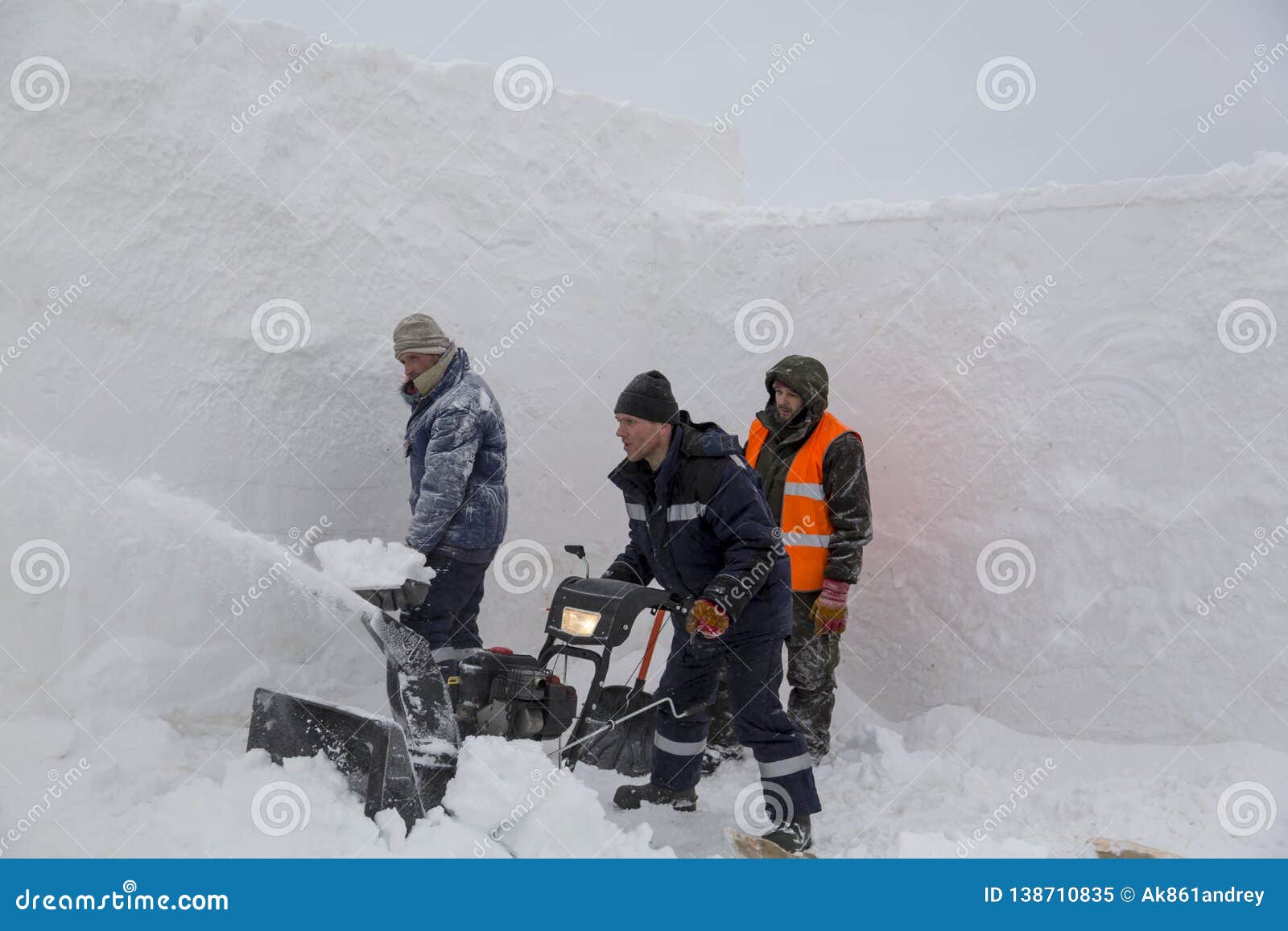 Three Workers in a Snowstorm during Snow Removal Stock Image - Image of ...