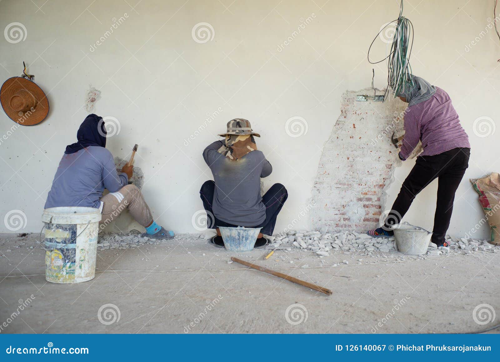 Workers Removing the Plastered Cement Surface on the Bricklayer ...