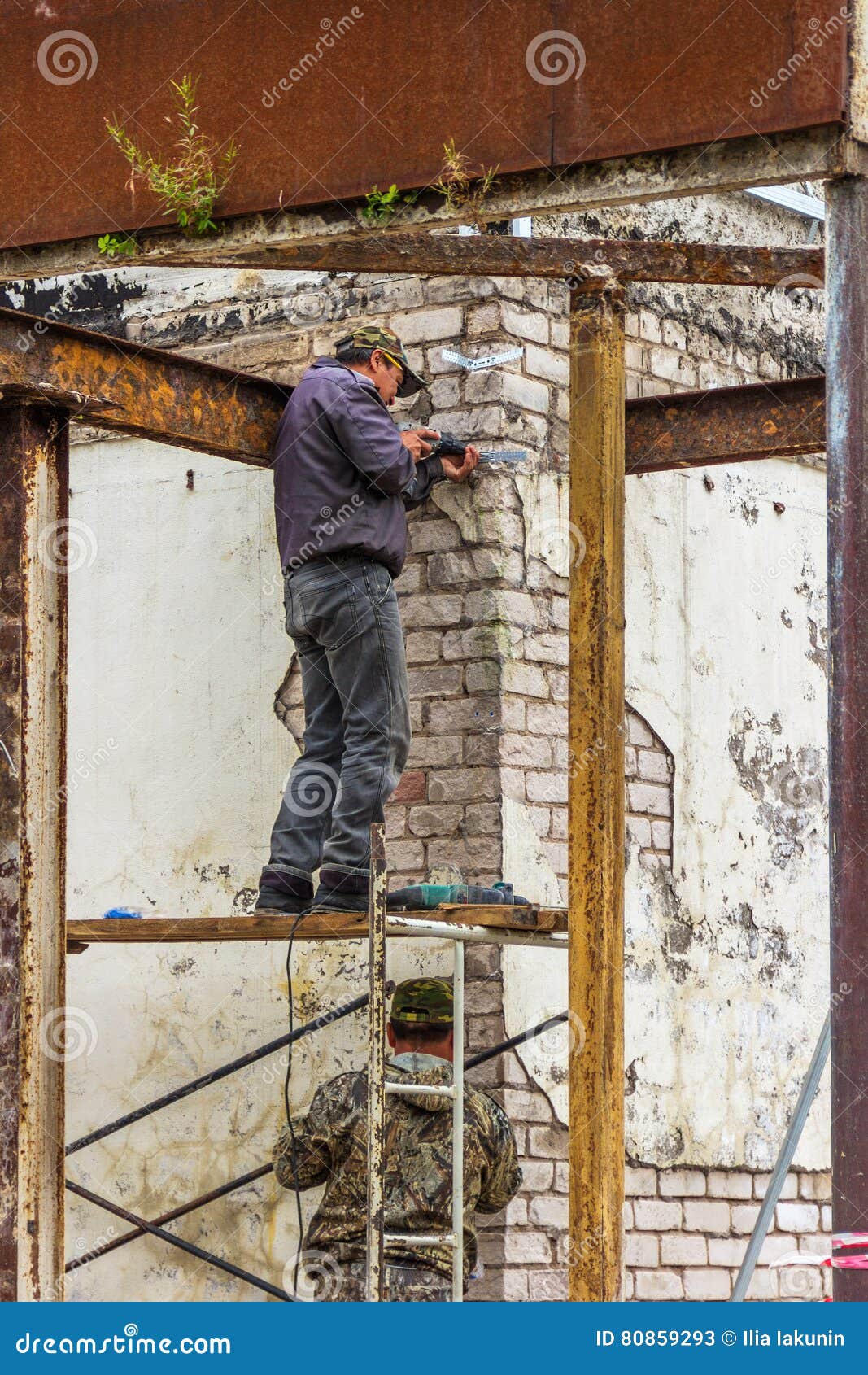 Workers Repair the Facade of the Building. Editorial Stock Photo ...