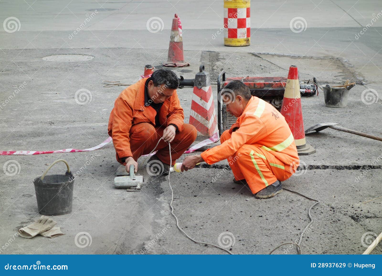 Workers are repairing road editorial stock image. Image of equipment ...