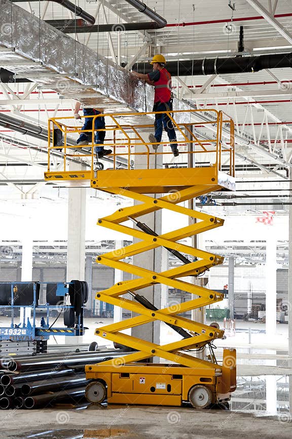 Workers on the Riser at the Construction Site Editorial Image - Image ...