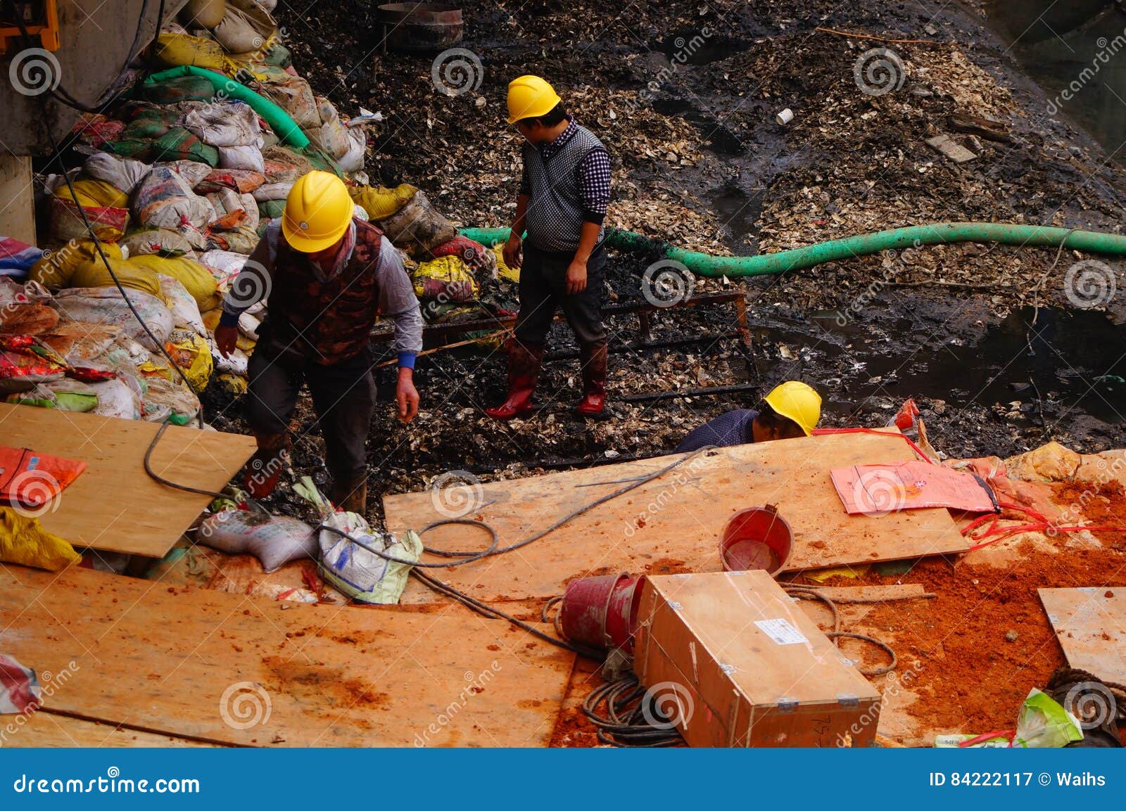 Workers in the River Construction, Pry an Iron Shelf Editorial ...