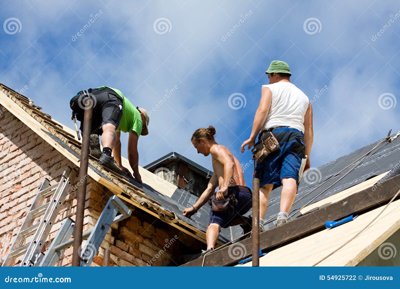Workers on the roof stock photo. Image of construction - 54925722