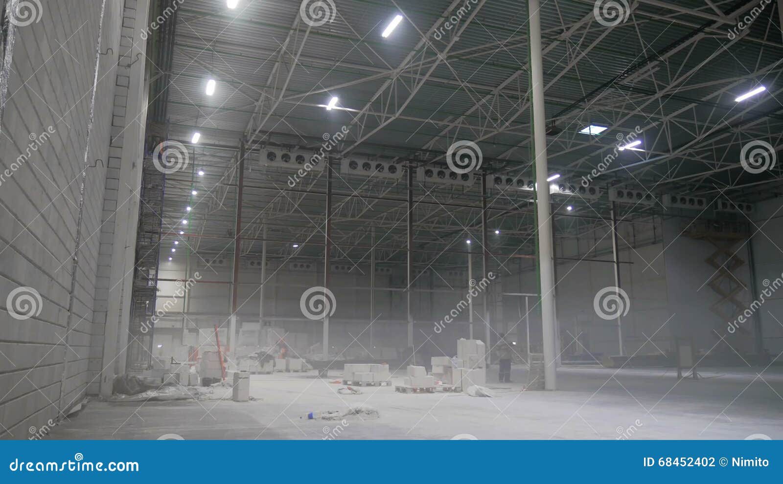 The Workers on the Scaffolding Inside a Large and Modern Warehouse ...