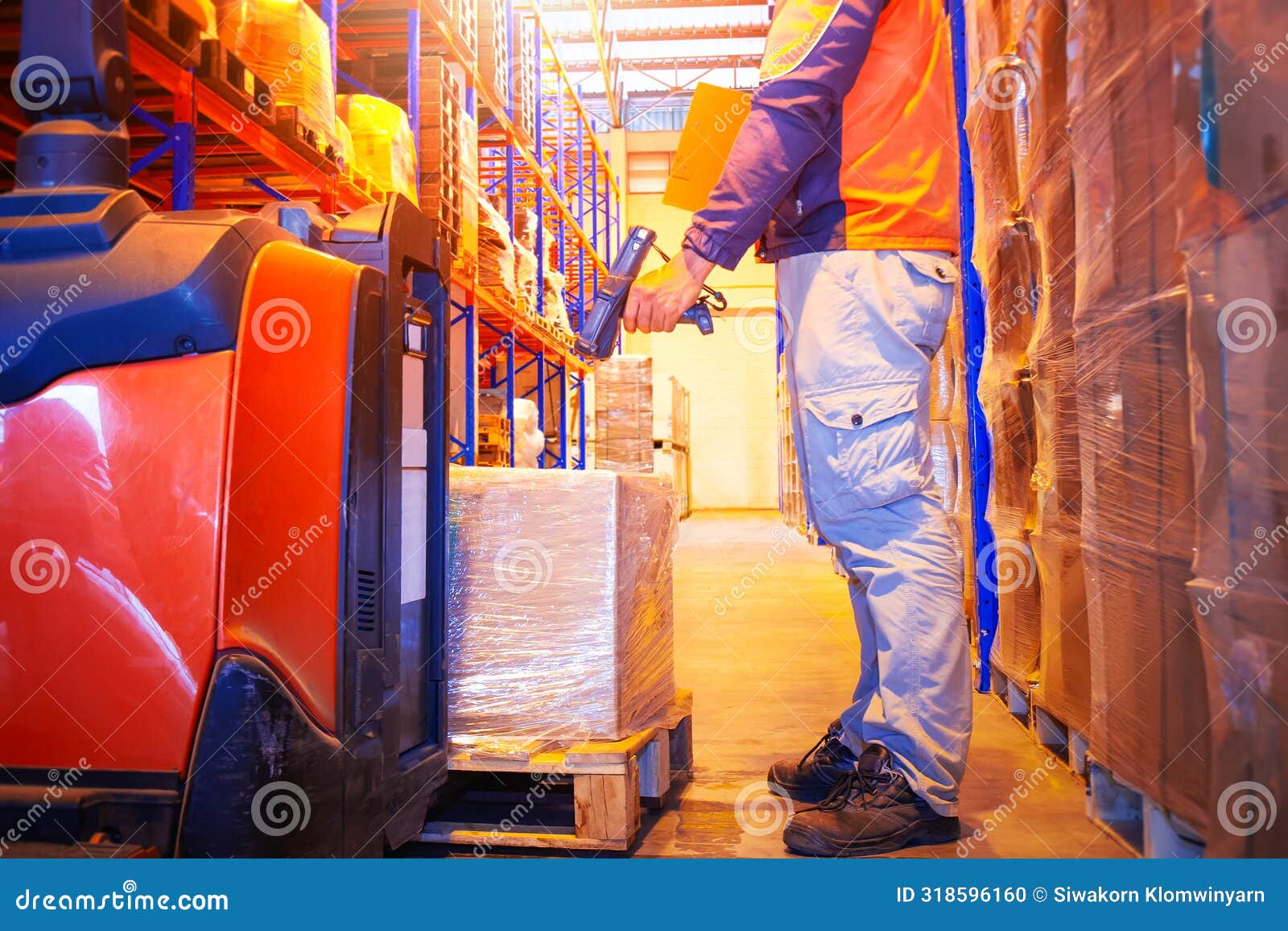 Workers Scanning Barcode Scanner on a Package Boxes. Storage Warehouse ...