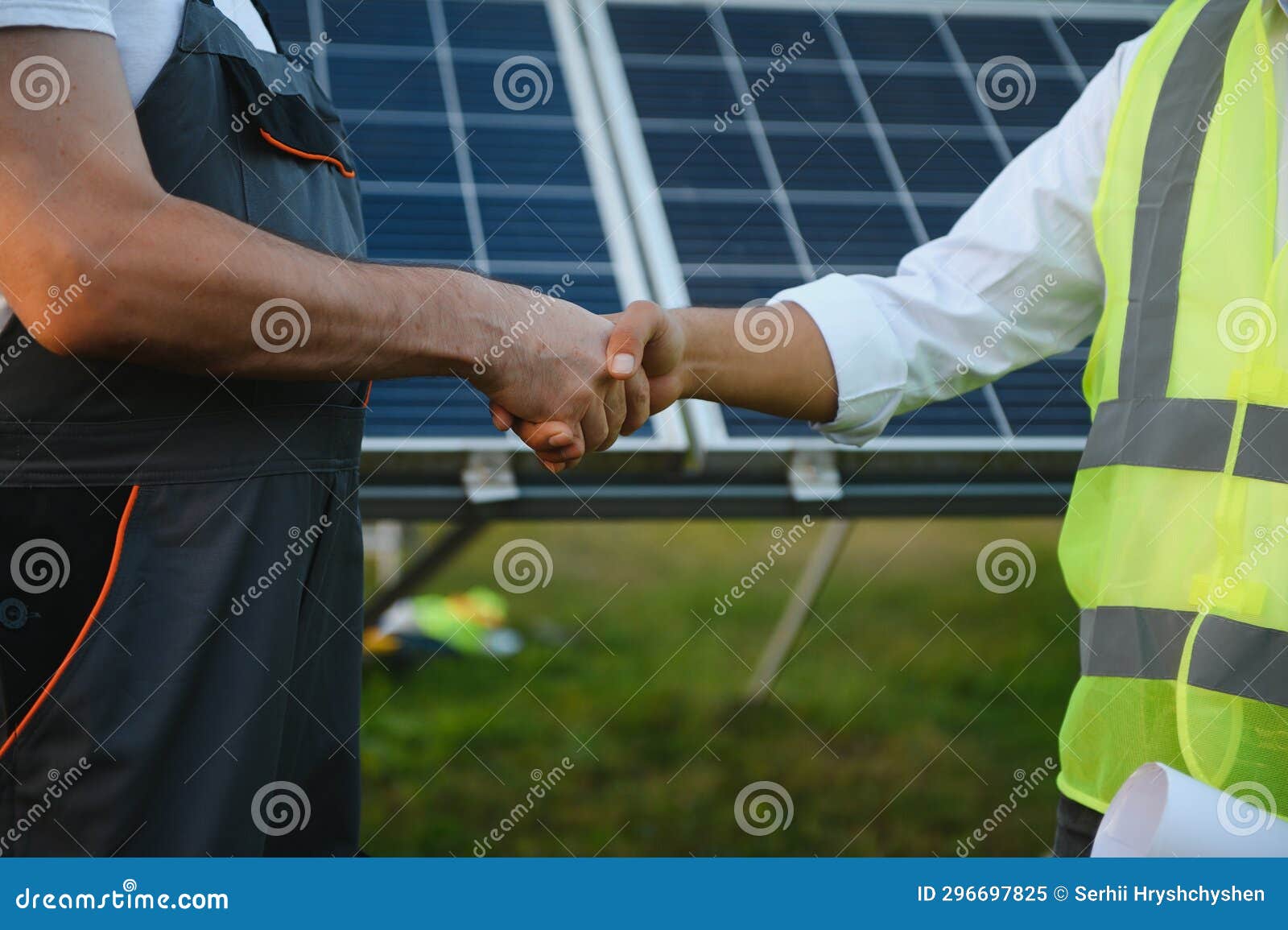 Workers Shaking Hands on a Background of Solar Panels on Solar Power ...