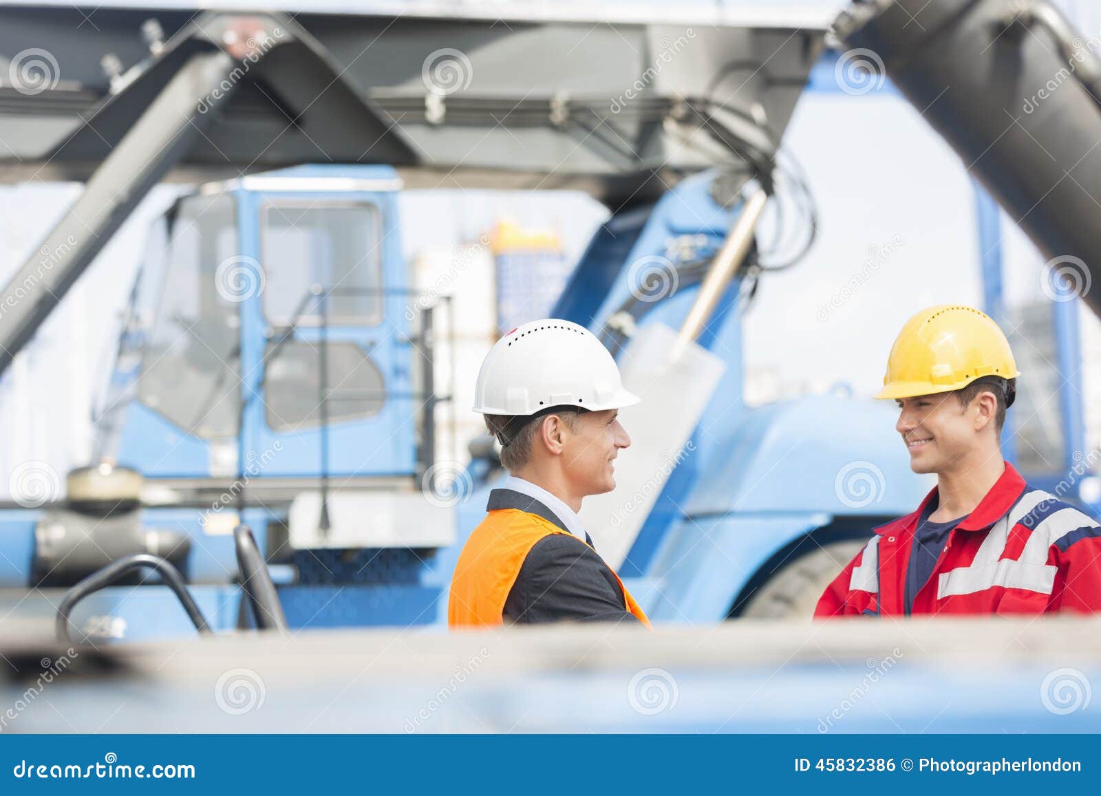 Workers Shaking Hands in Shipping Yard Stock Photo - Image of midadult ...