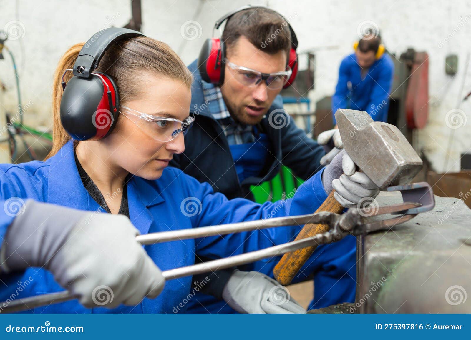 Workers Shaping Metal with Hammer Over Anvil Stock Photo - Image of ...