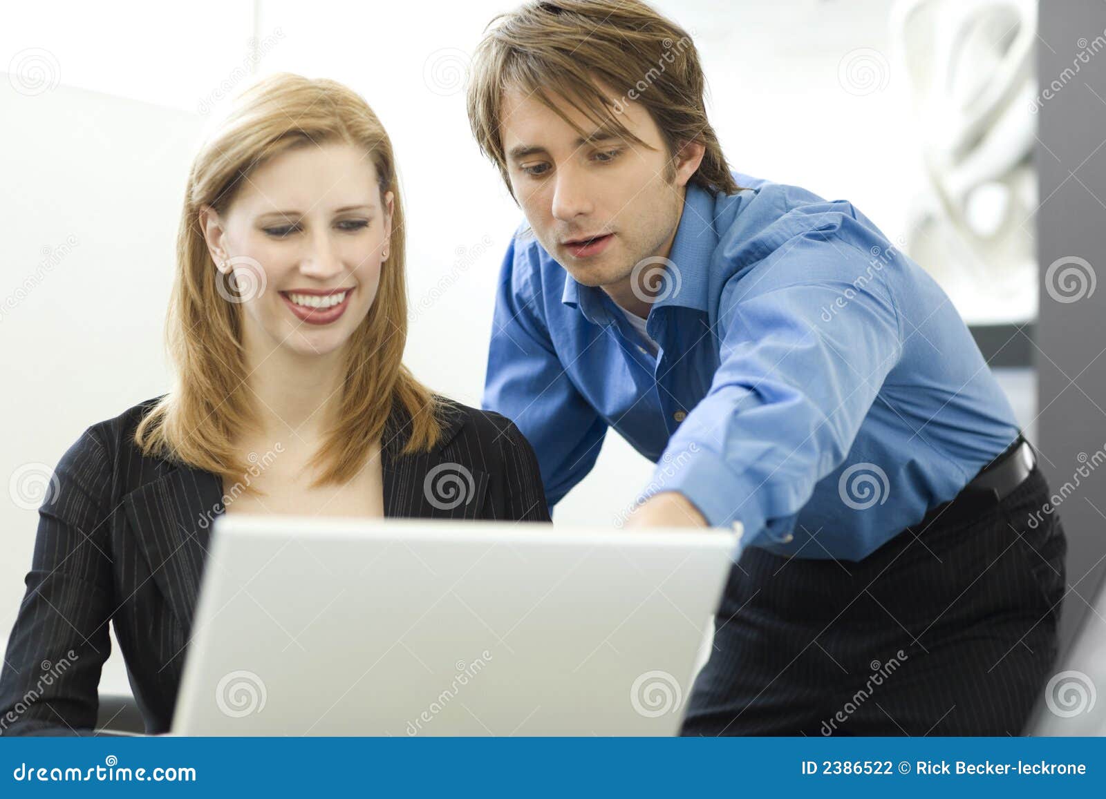 Workers share a computer stock photo. Image of blue, browse - 2386522