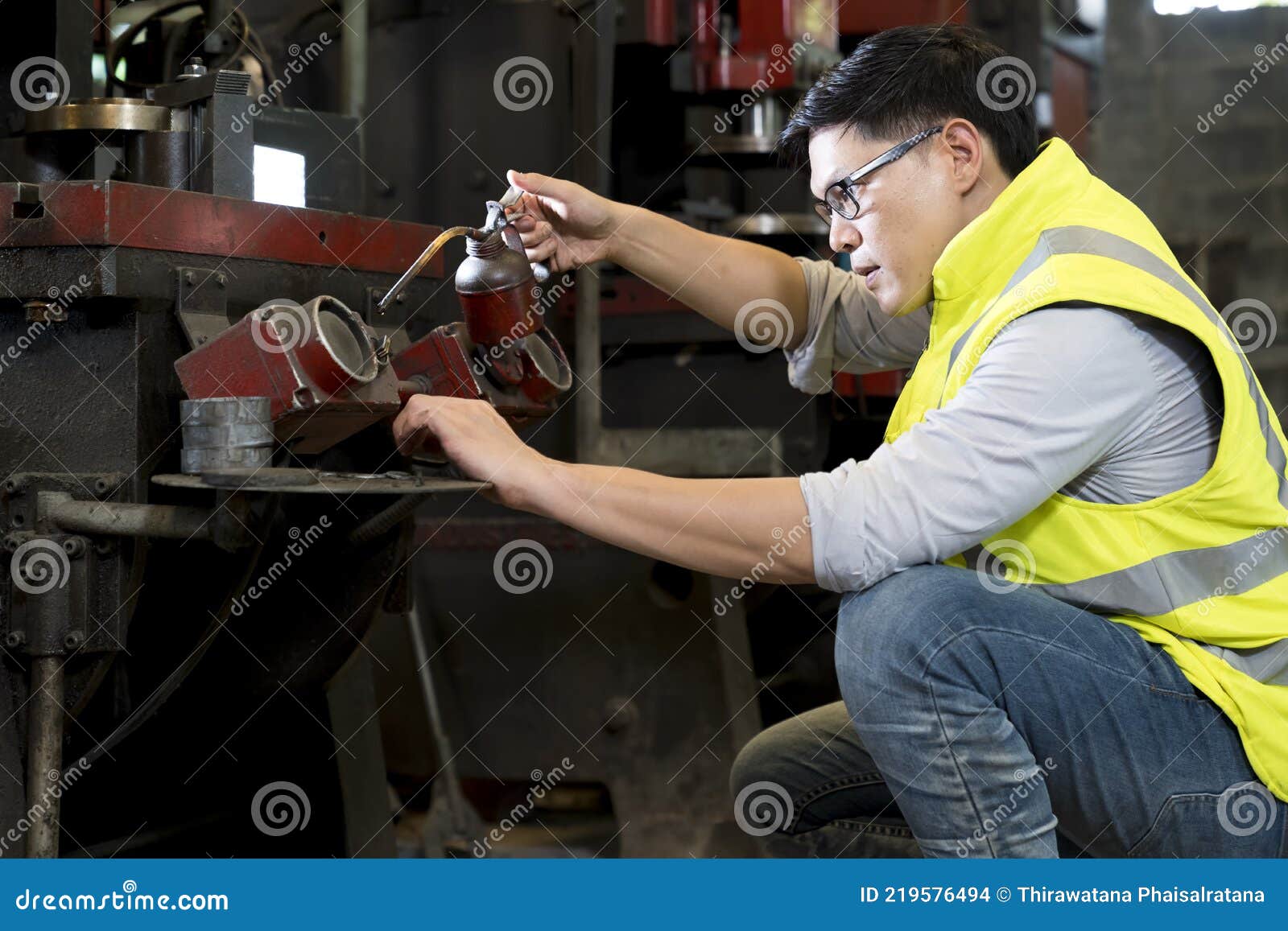 Workers Sitting Behind the Machines at the Factory and Work ...