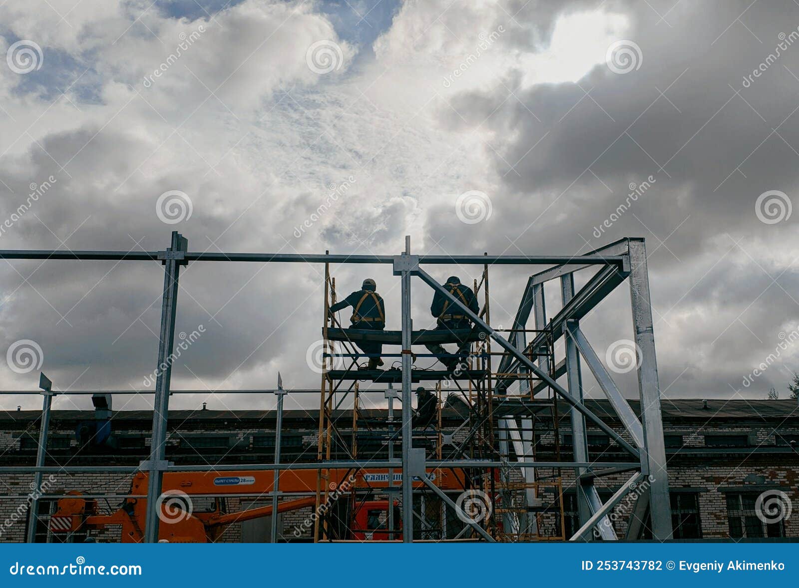 Workers Sitting on a Metal Structure Stock Photo - Image of industrial ...
