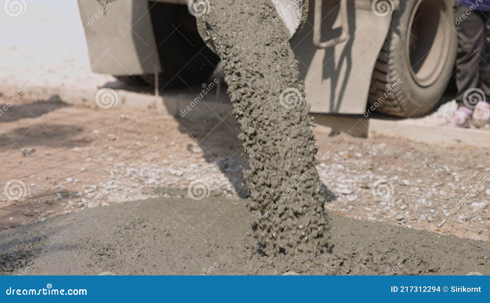 Workers are Spreading the Concrete that Flows and Pouring from a Cement ...