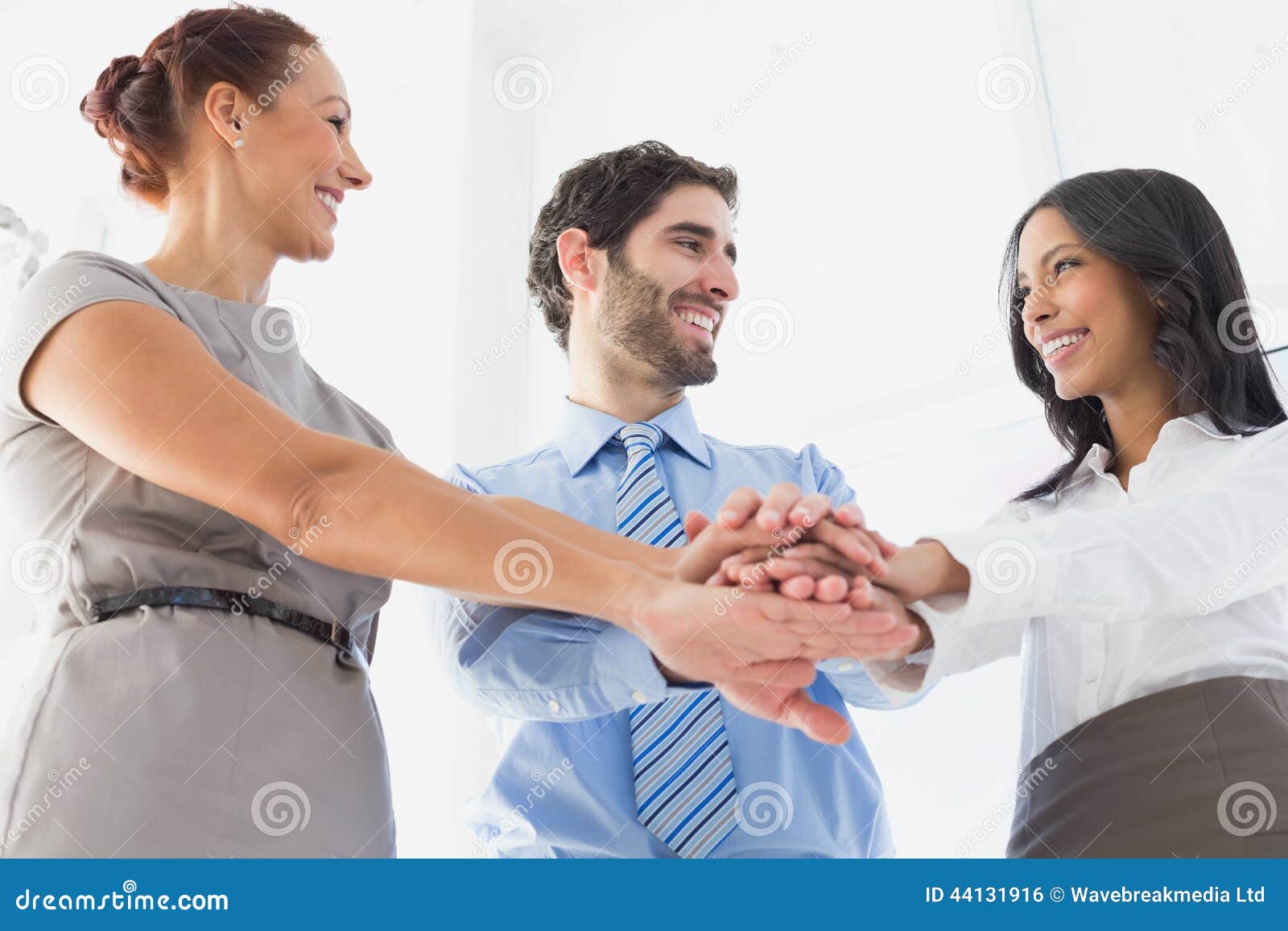 Workers with Stacked Hands Smiling Stock Photo - Image of away, eastern ...