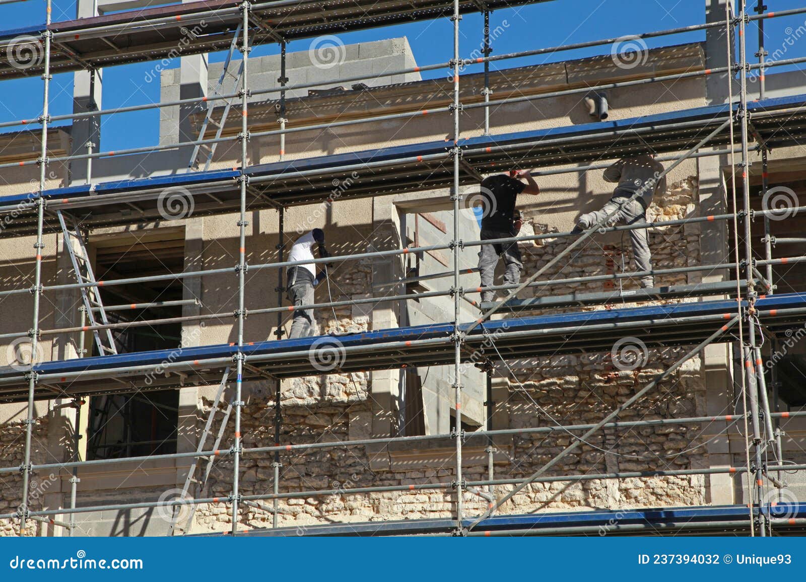 Workers on a Stone Wall Renovation Project Stock Photo - Image of ...