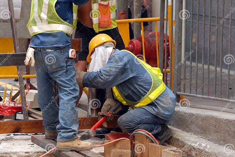 Workers at Street Level stock image. Image of sewage, labor - 1104051