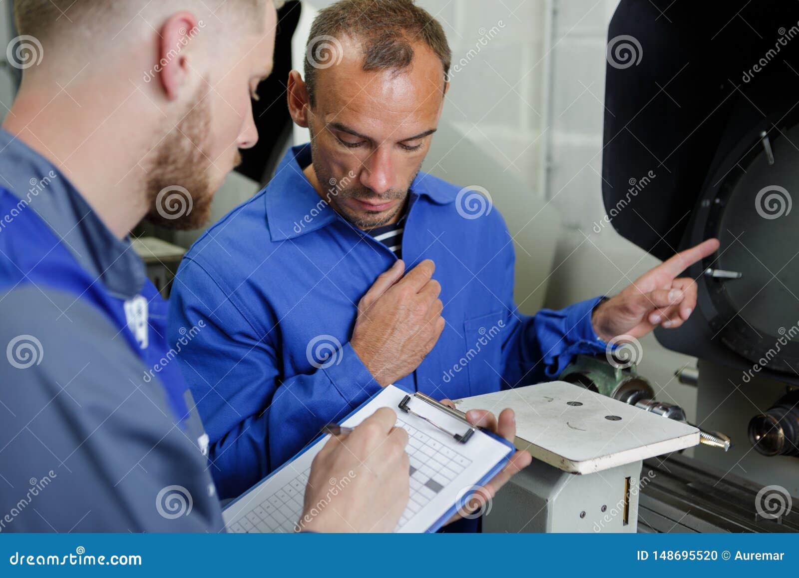 Workers Taking Machine Readings in Control Room Stock Photo - Image of ...