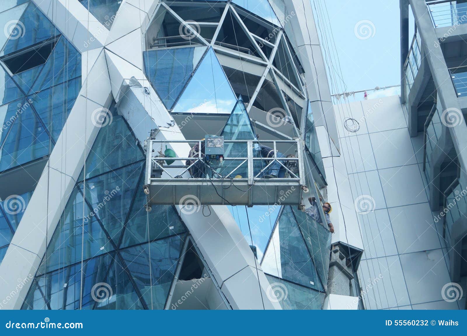 Workers in tall buildings editorial photography. Image of workers ...