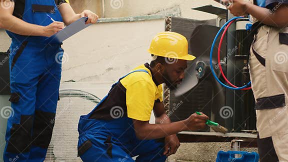 Workers Tasked with Condenser Cleaning Stock Photo - Image of ... Workers Tasked with Condenser Cleaning Stock Photo - Image of ...