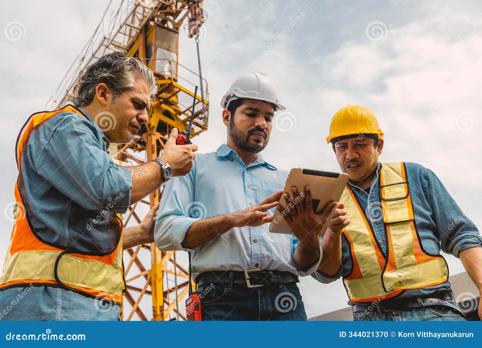 Workers Team Working Together with Contractor at Construction Site ...