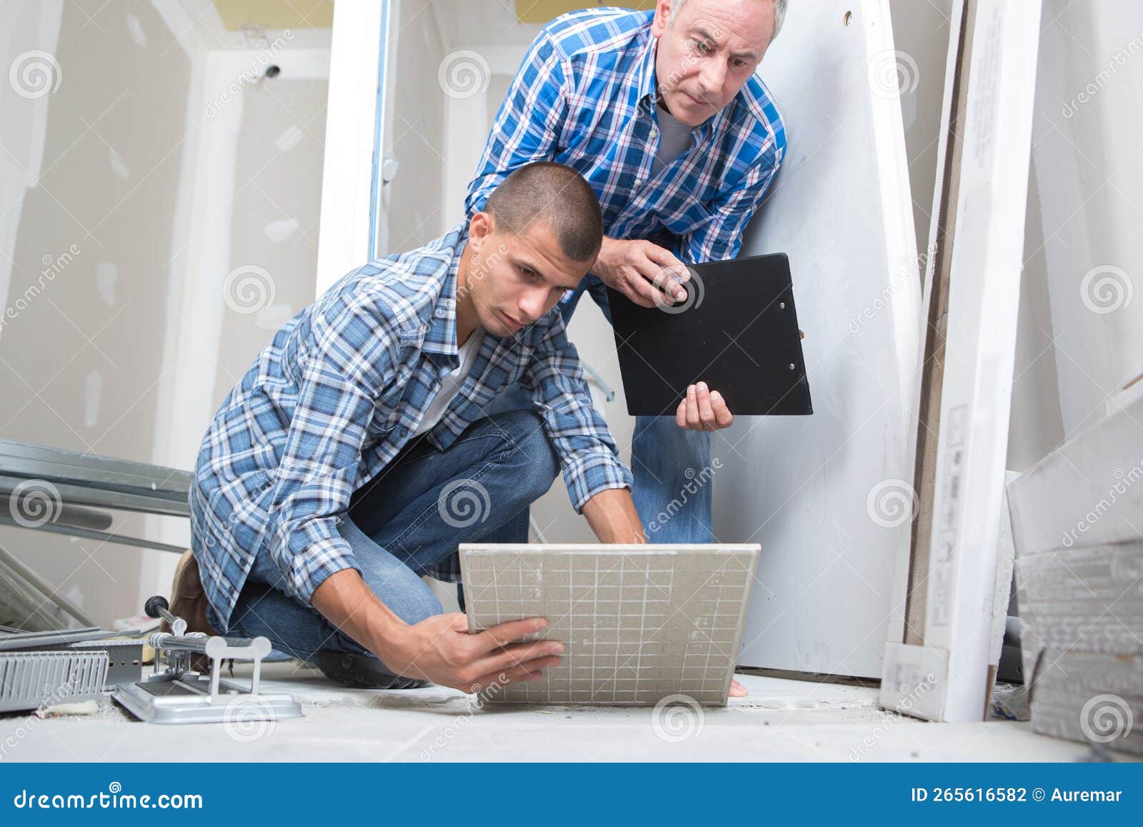 Workers and Tile Setting Apprentice Stock Photo - Image of poser ...
