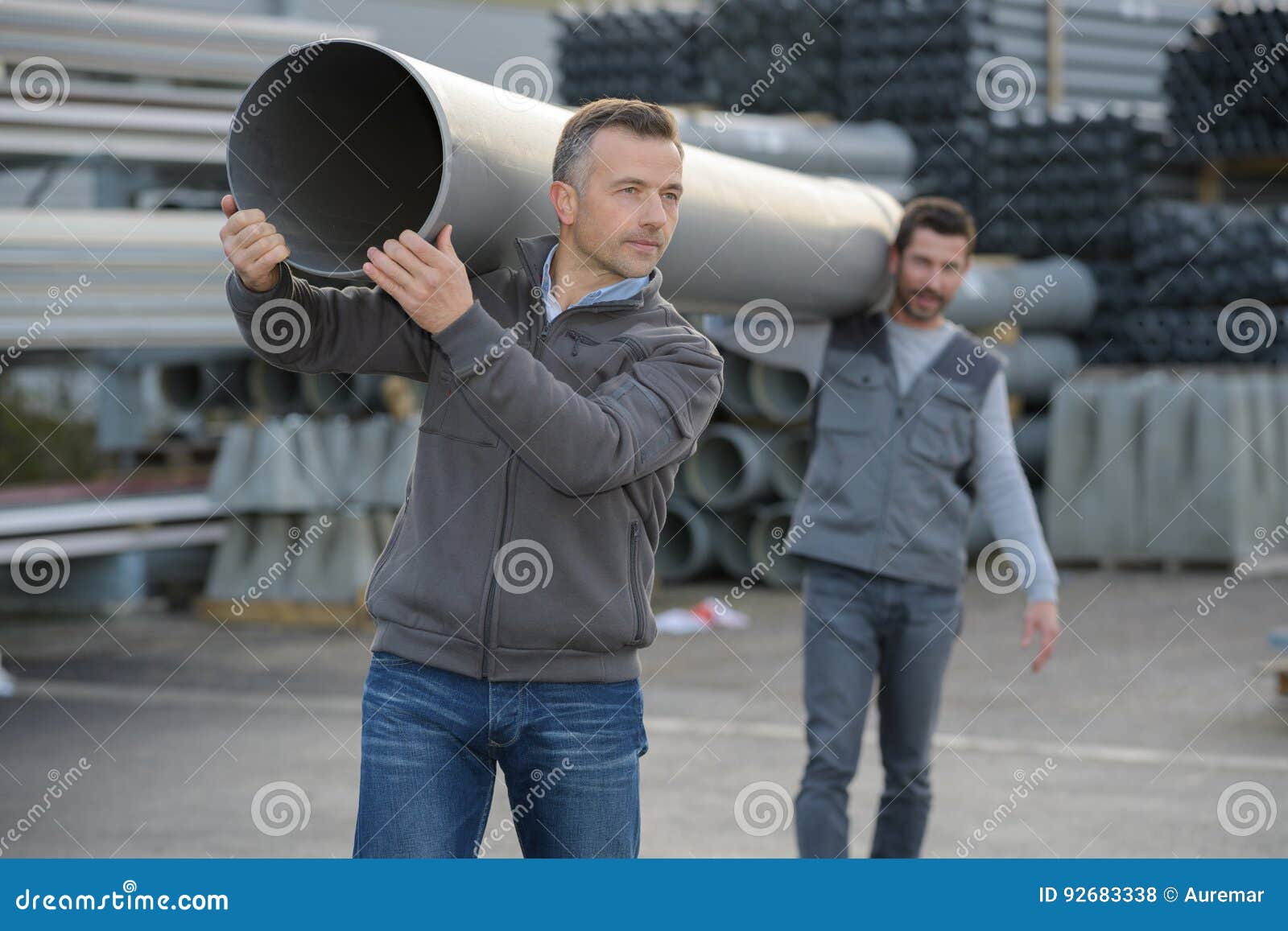 Workers Transporting Water Pipe Stock Photo - Image of excavation ...