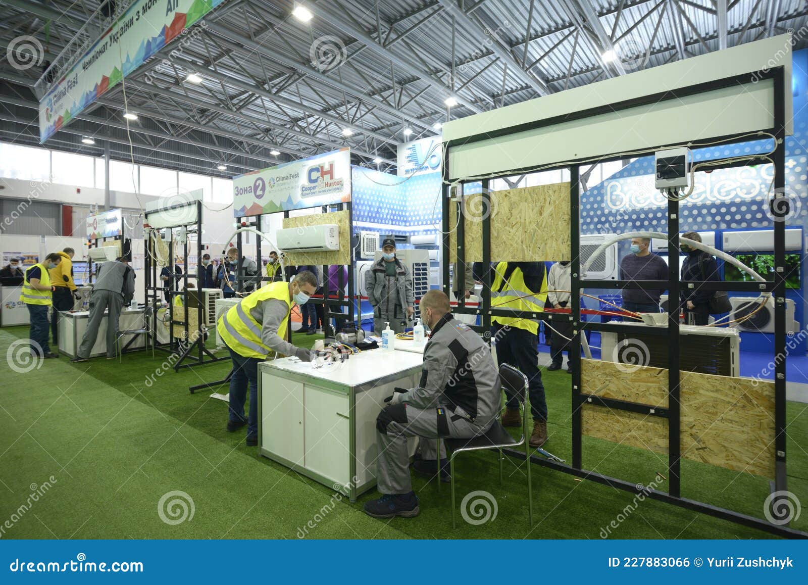Workers in Uniform Preparing Stands with Plumbing Tools and Equipment ...