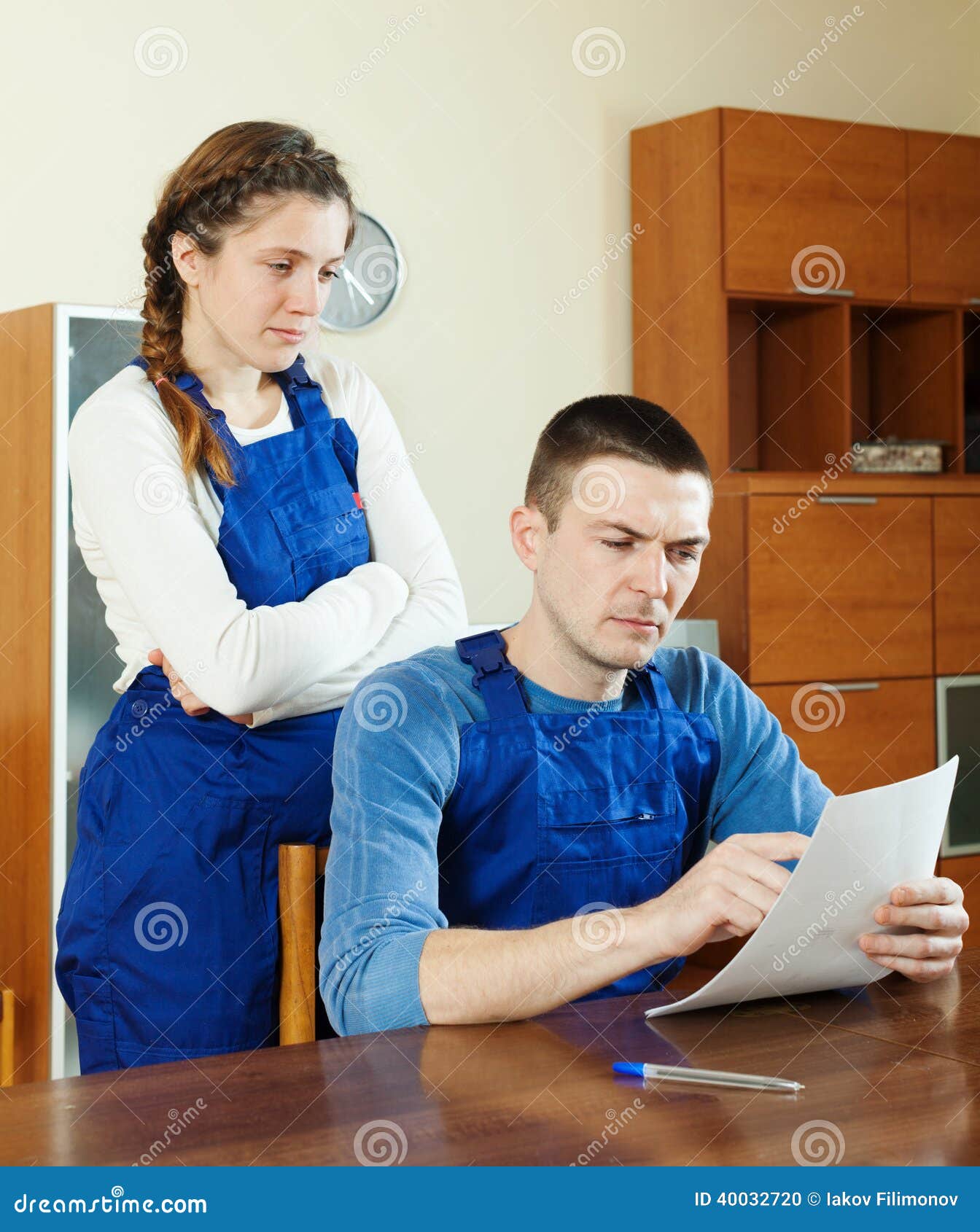 Workers in Uniform Reading Documents Stock Photo - Image of person ...