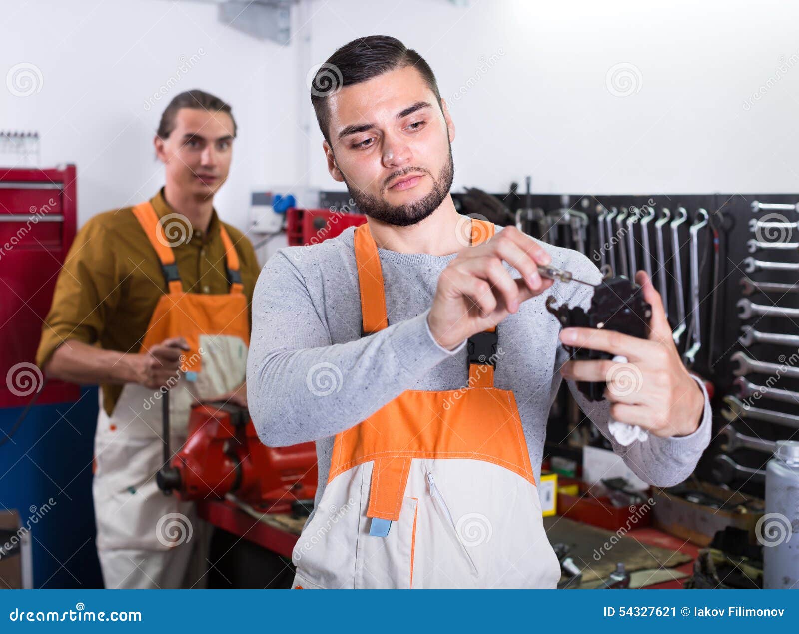 Workers in Uniform at Workshop Stock Image - Image of machine, males ...