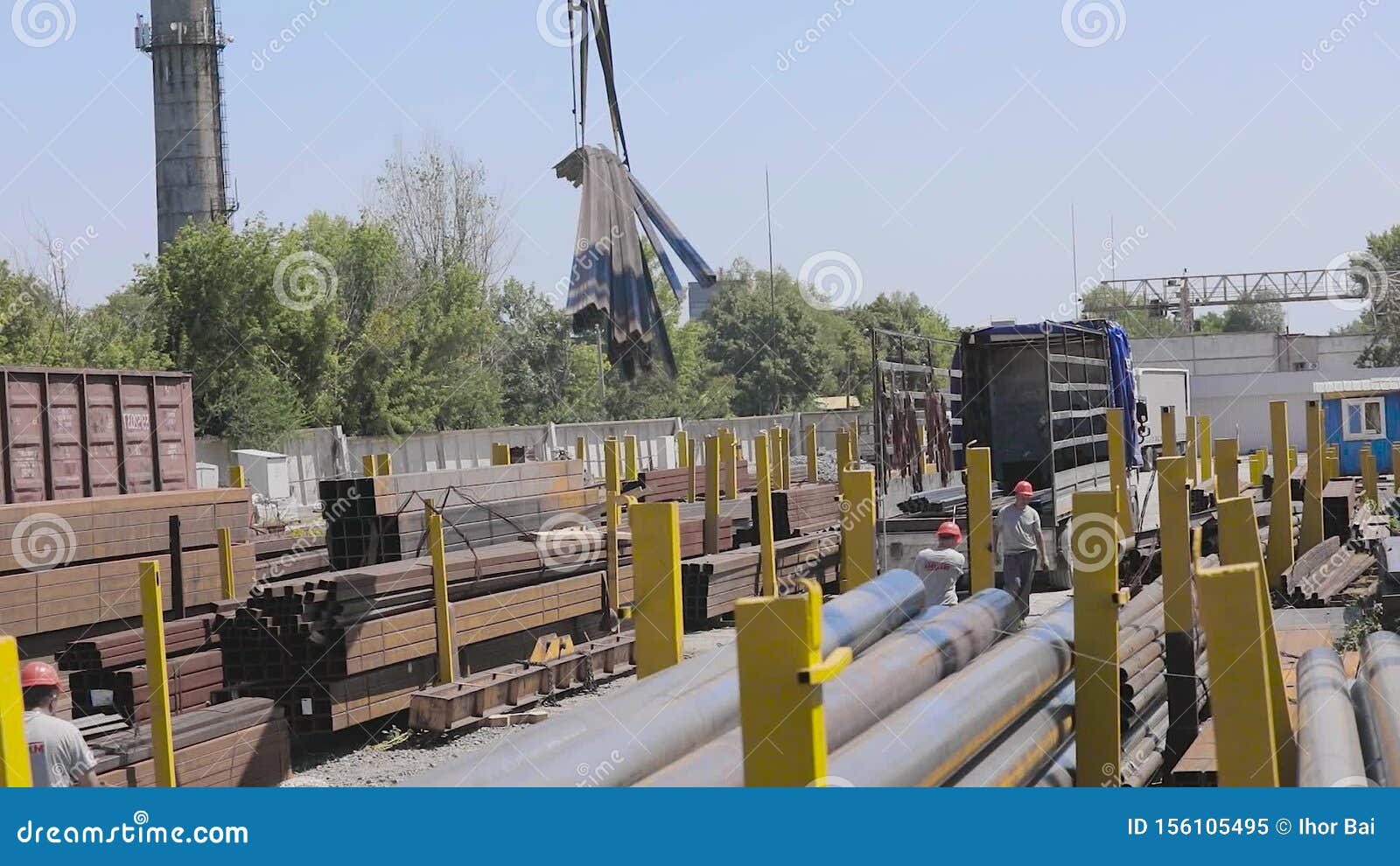 The Working Process in a Warehouse with a Metal. Workers Unload a Metal ...