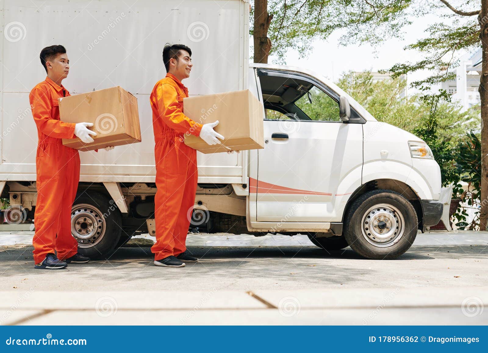 Workers unloading car stock photo. Image of service - 178956362
