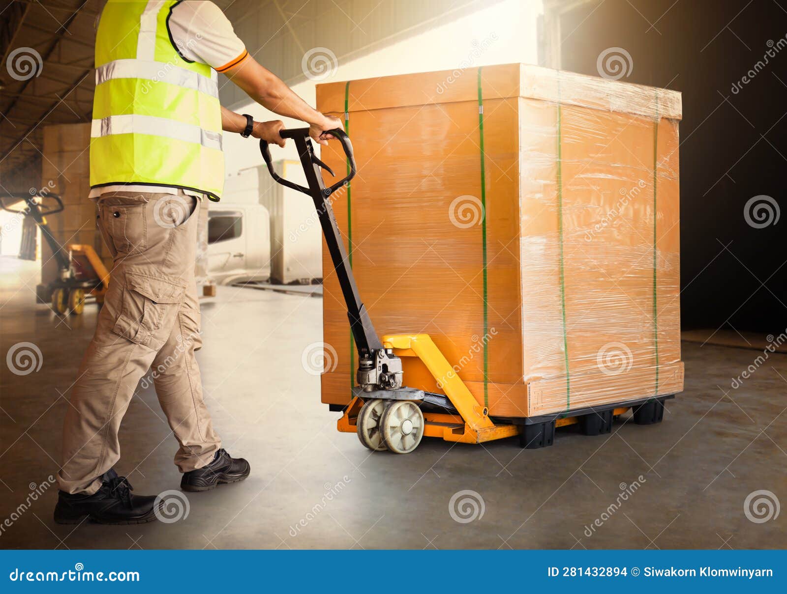 Workers Unloading Heavy Package Boxes into Container Truck. Shipping ...