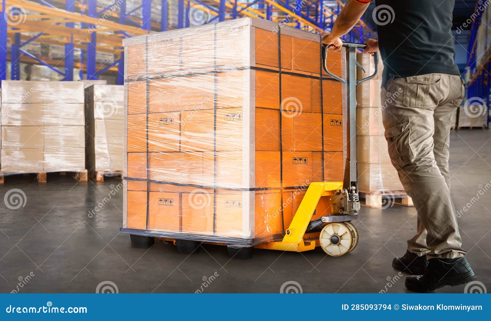 Workers Unloading Package Boxes on Pallet in Warehouse. Supply Chain ...