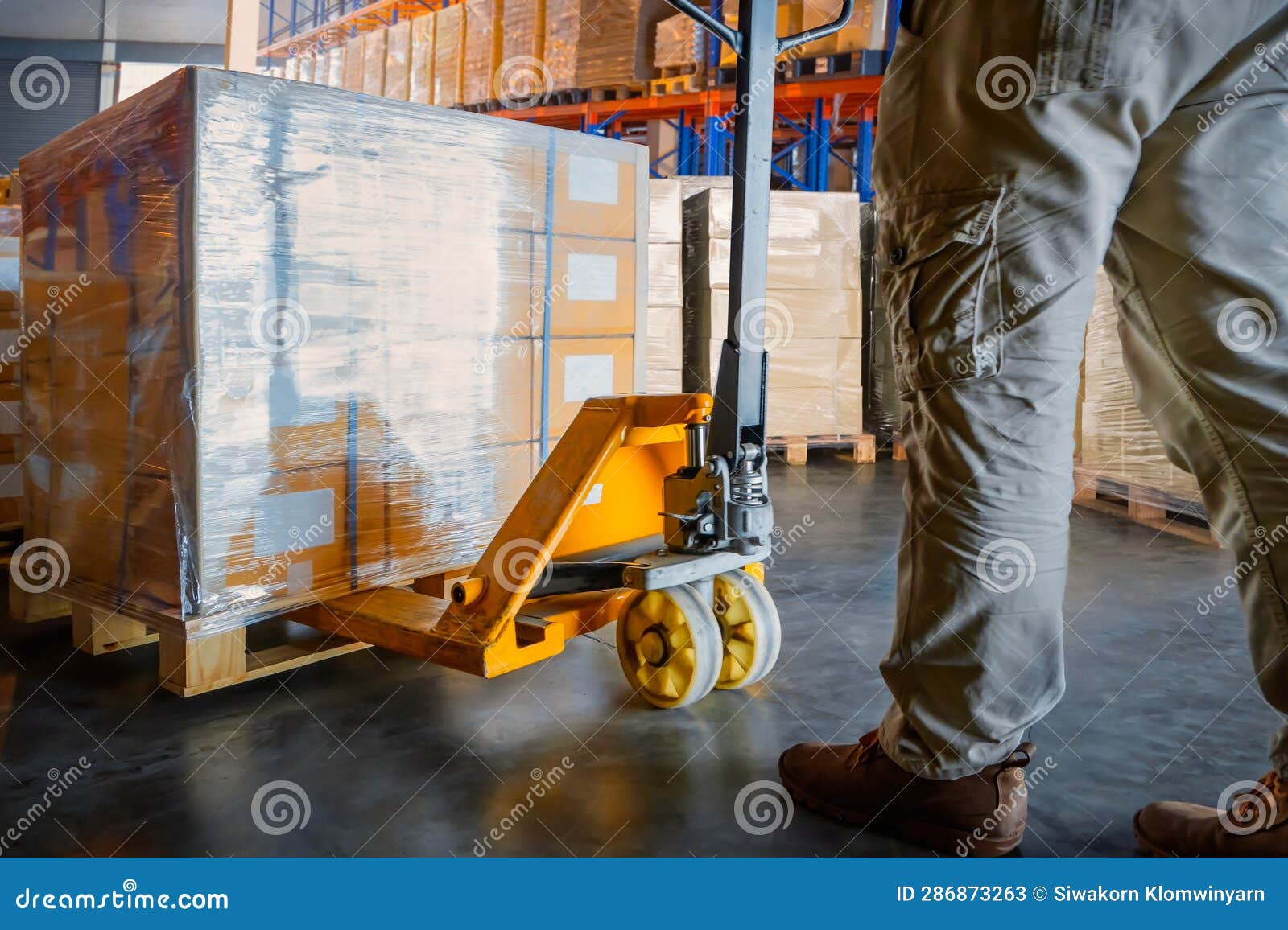 Workers Unloading Package Boxes on Pallets in Storage Warehouse ...