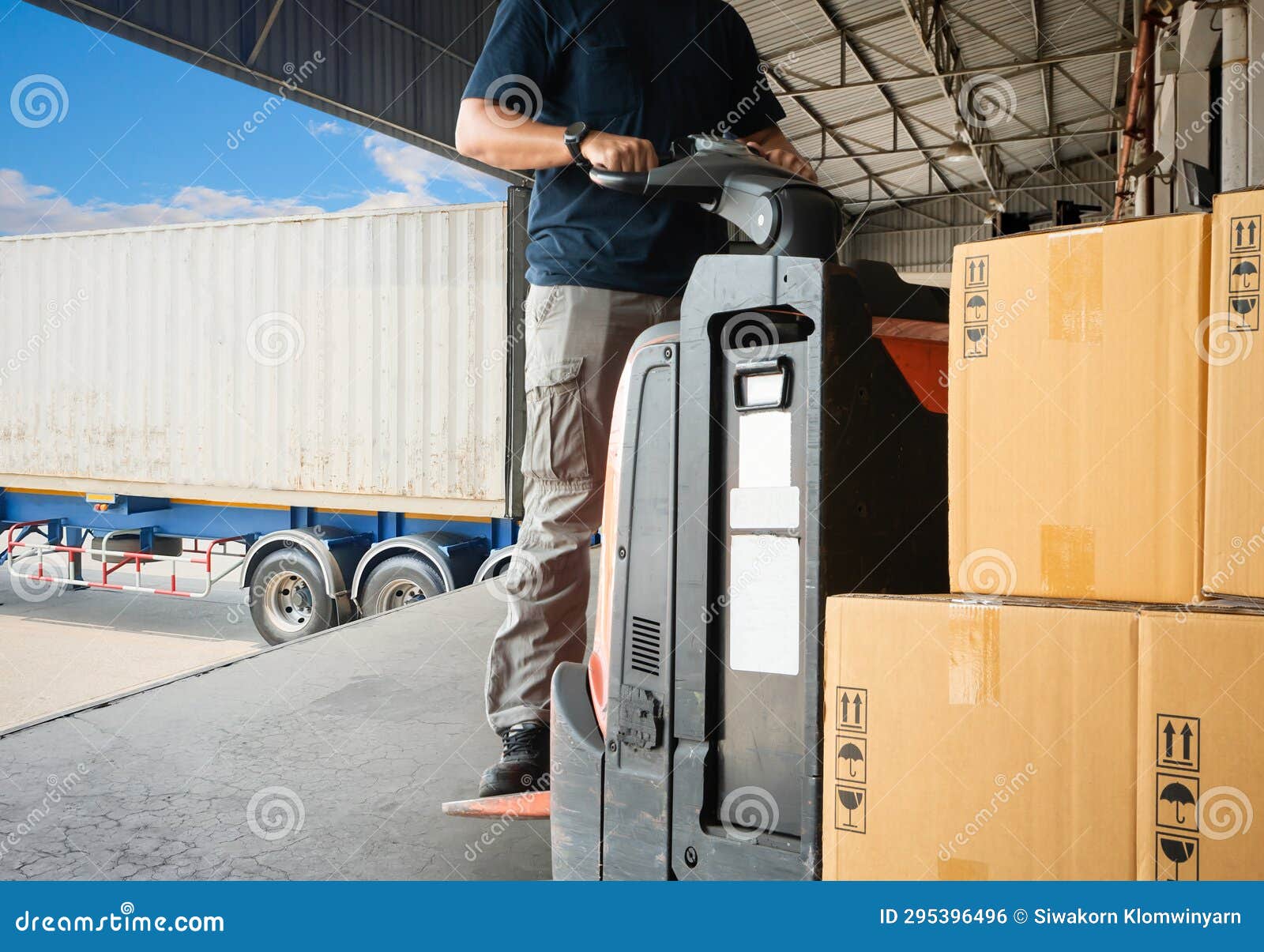 Workers Unloading Package Boxes in Storage Warehouse. Forklift Pallet ...