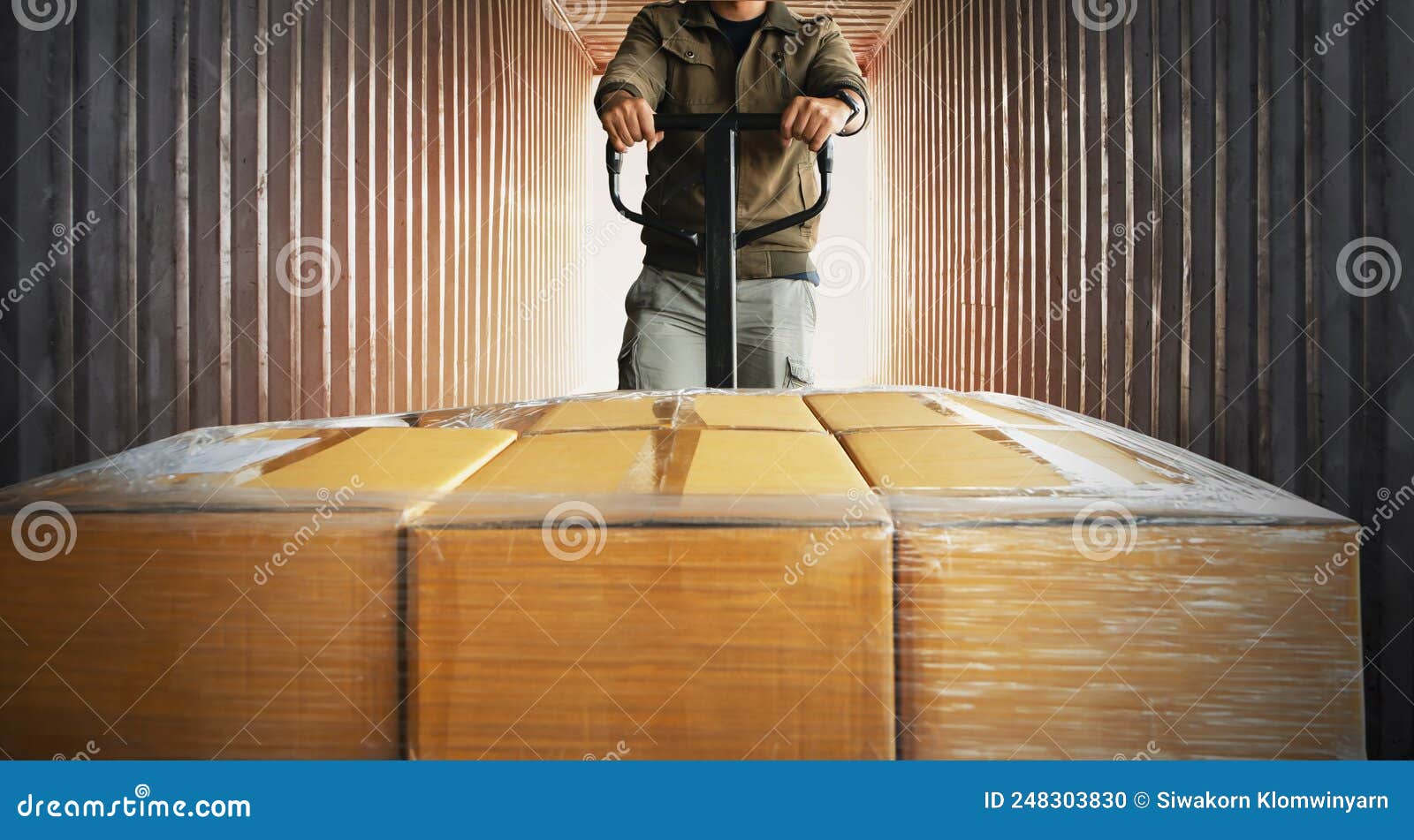 Workers Unloading Packaging Boxes into Cargo Container. Delivery ...