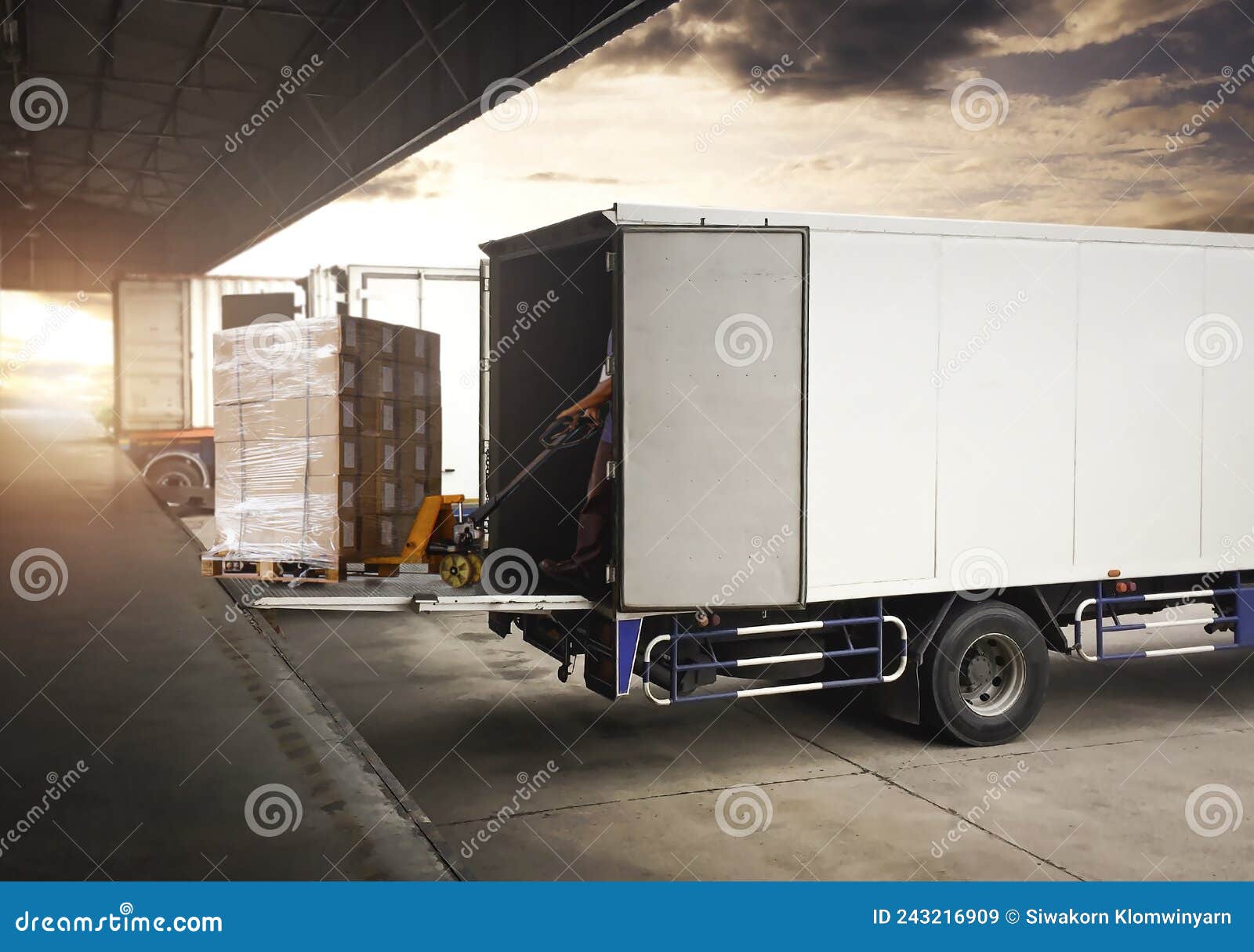 Workers Unloading Packaging Boxes on Pallet into Cargo Container ...