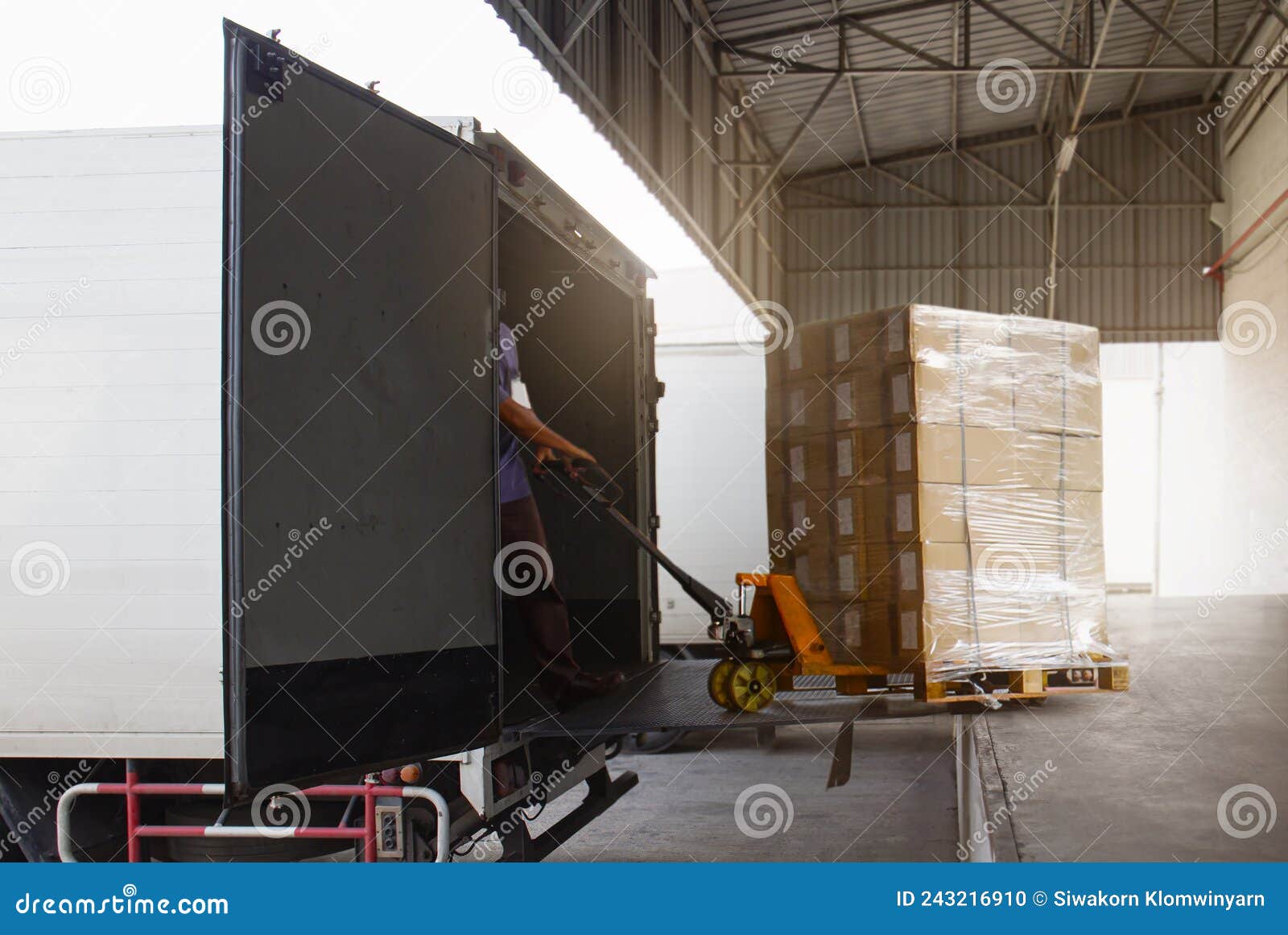 Workers Unloading Packaging Boxes on Pallet into Cargo Container ...