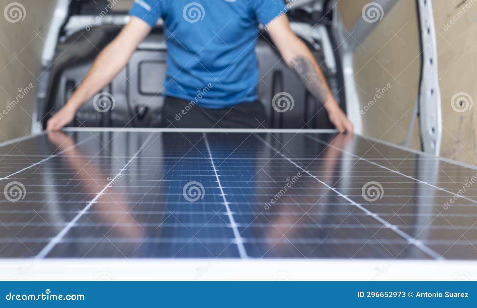 Workers Unloading Solar Panels from a Van. Stock Image - Image of ...