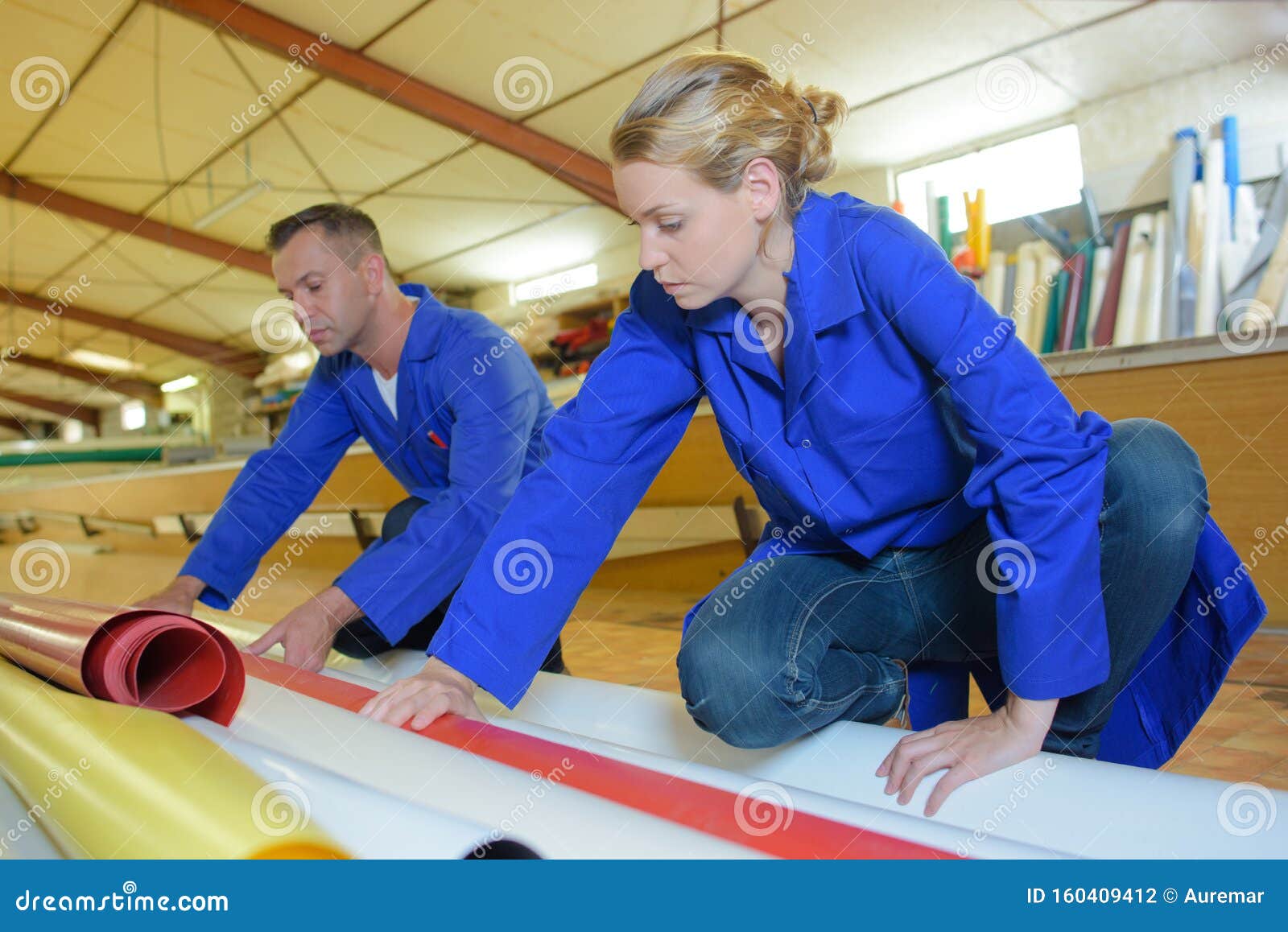Workers Unrolling Paper Sheets Stock Photo - Image of handsome, unroll ...