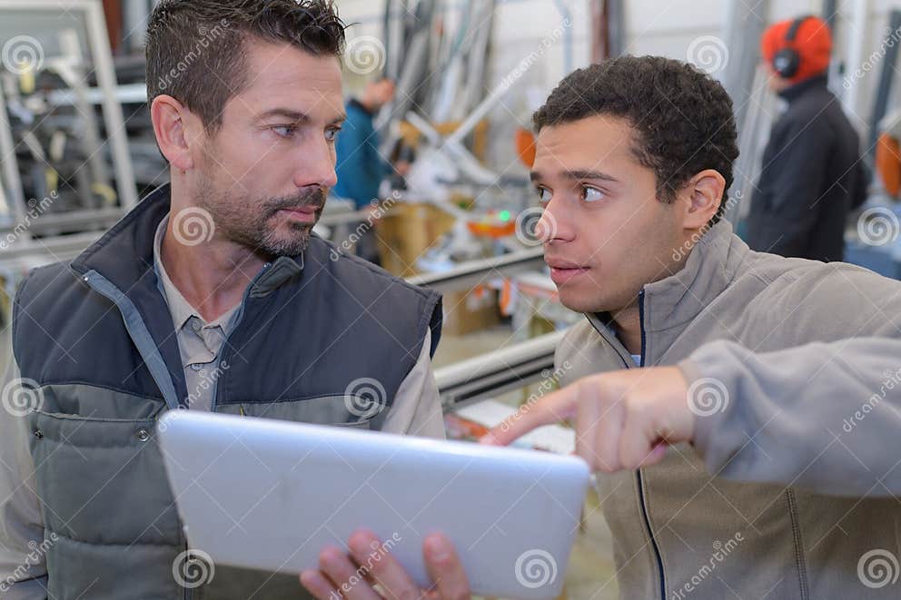 Workers Using Digital Tablet in Warehouse Stock Image - Image of ...